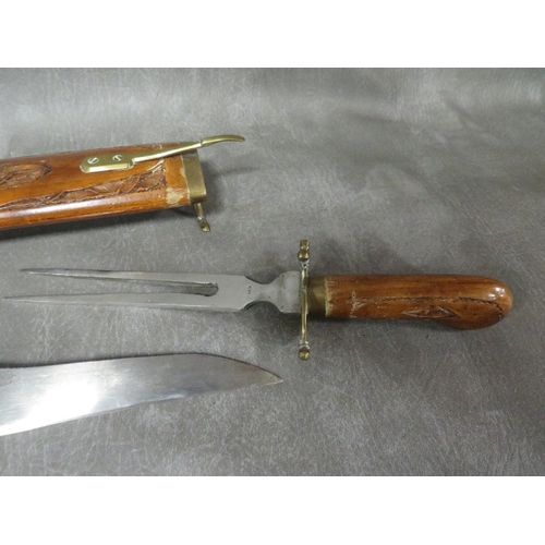 A Middle Eastern style carving set in decorative wooden stand
