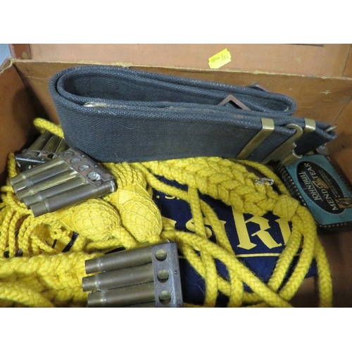 A small leather case of militaria collectables