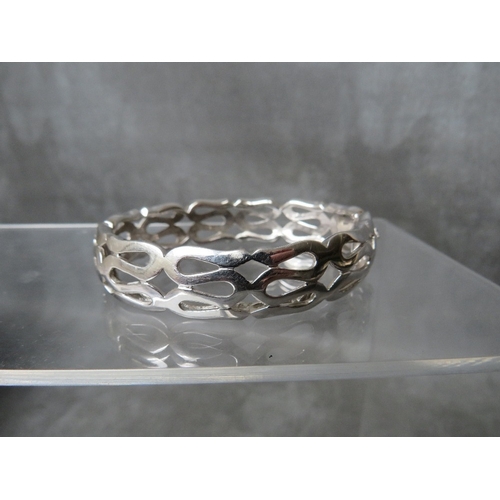 A BOXED 18CT WHITE GOLD LADIES VERSACE BANGLE, reticulated design, with ...