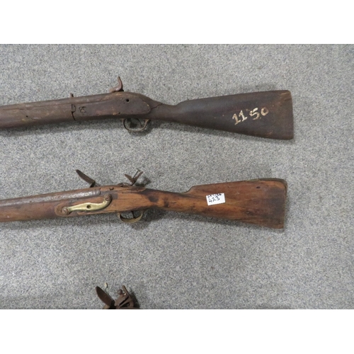 Two antique long bore flintlock rifles together with a pin fire rifle A ...