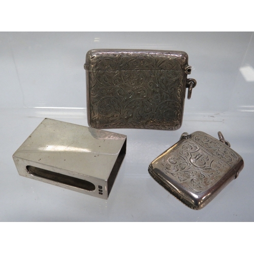 A small hallmarked silver vesta together with a larger example A/F and ...
