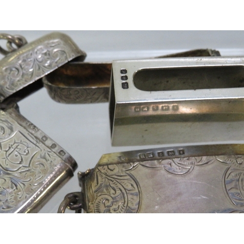 A small hallmarked silver vesta together with a larger example A/F and ...