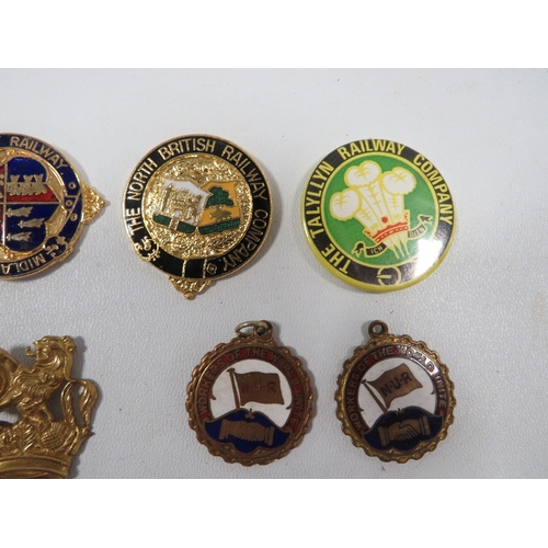 A tin of railway badges, medals and buttons