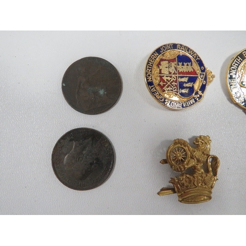 A tin of railway badges, medals and buttons