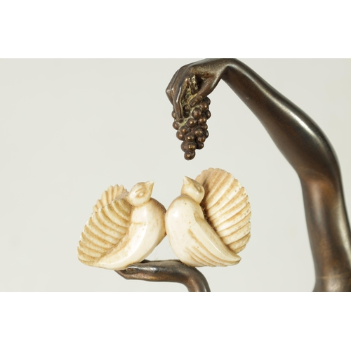 LUCILLE SEVIN. AN ART DECO SILVERED AND PATINATED BRONZE SCULPTURE OF A ...