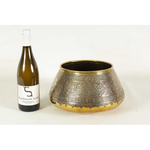 A 19TH CENTURY MIDDLE EASTERN ISLAMIC CAIRO-WARE BRASS BOWL profusely ...