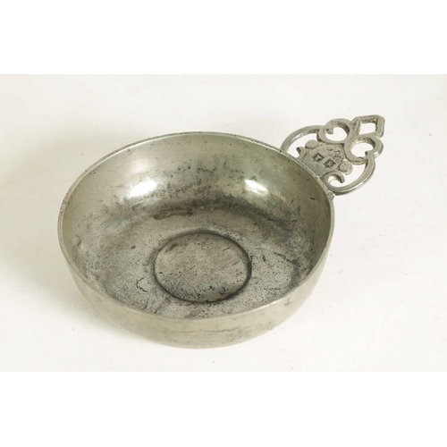 A RARE ENGLISH PEWTER PORRINGER CIRCA 1663 with a single open fretted ...