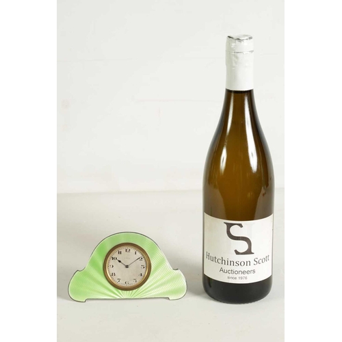 AN ART DECO SILVER AND GUILLOCHE ENAMEL STRUT CLOCK the silvered dial ...