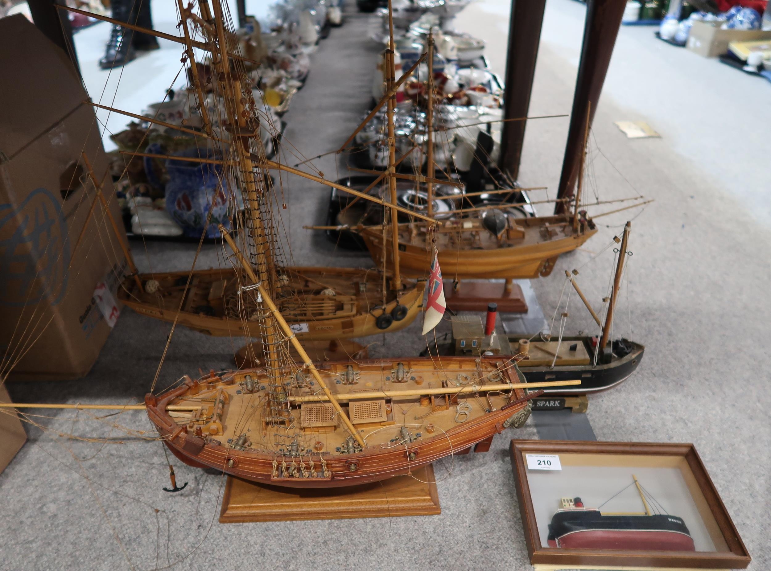 Three scratch built models of boats, another boat and a half ...