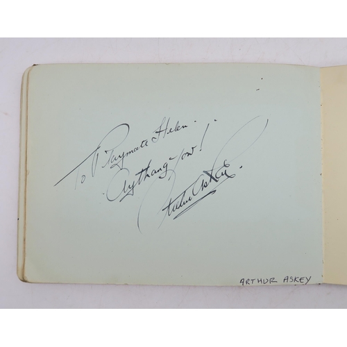 A leather-bound autograph book, with signatures to include players in ...