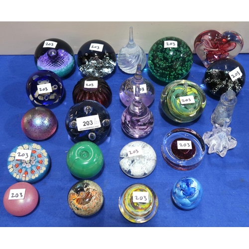 A collection of glass paperweights including a millefiori example dated ...
