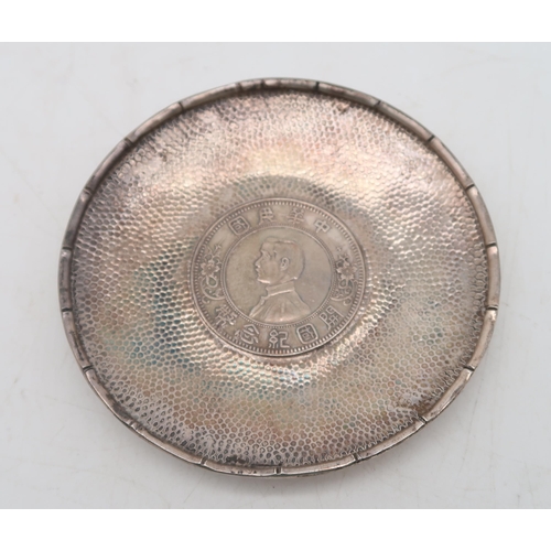 A collection of Chinese silver coin dishes, one inset with a Republic ...