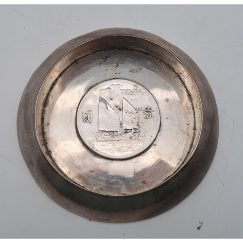 A collection of Chinese silver coin dishes, one inset with a Republic ...