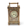A FRENCH CHAMPLEVE ENAMEL CARRIAGE CLOCKthe white dial with Roman ...
