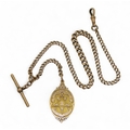 A 9ct gold rose gold tapered fob chain, with attached 9ct gold Masonic ...
