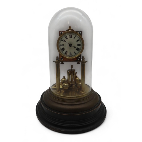 A brass anniversary clock, under glass dome
