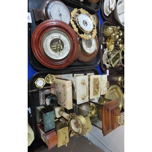 Assorted small clocks and timepieces and barometers