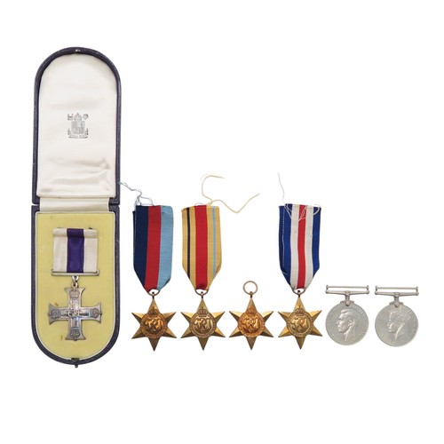 A WW2 MILITARY CROSS MEDAL GROUP OF SEVENAwarded to Temporary Captain ...
