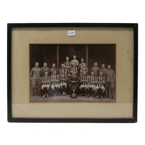 A WW1-period football team photograph, the ball to foreground marked ...