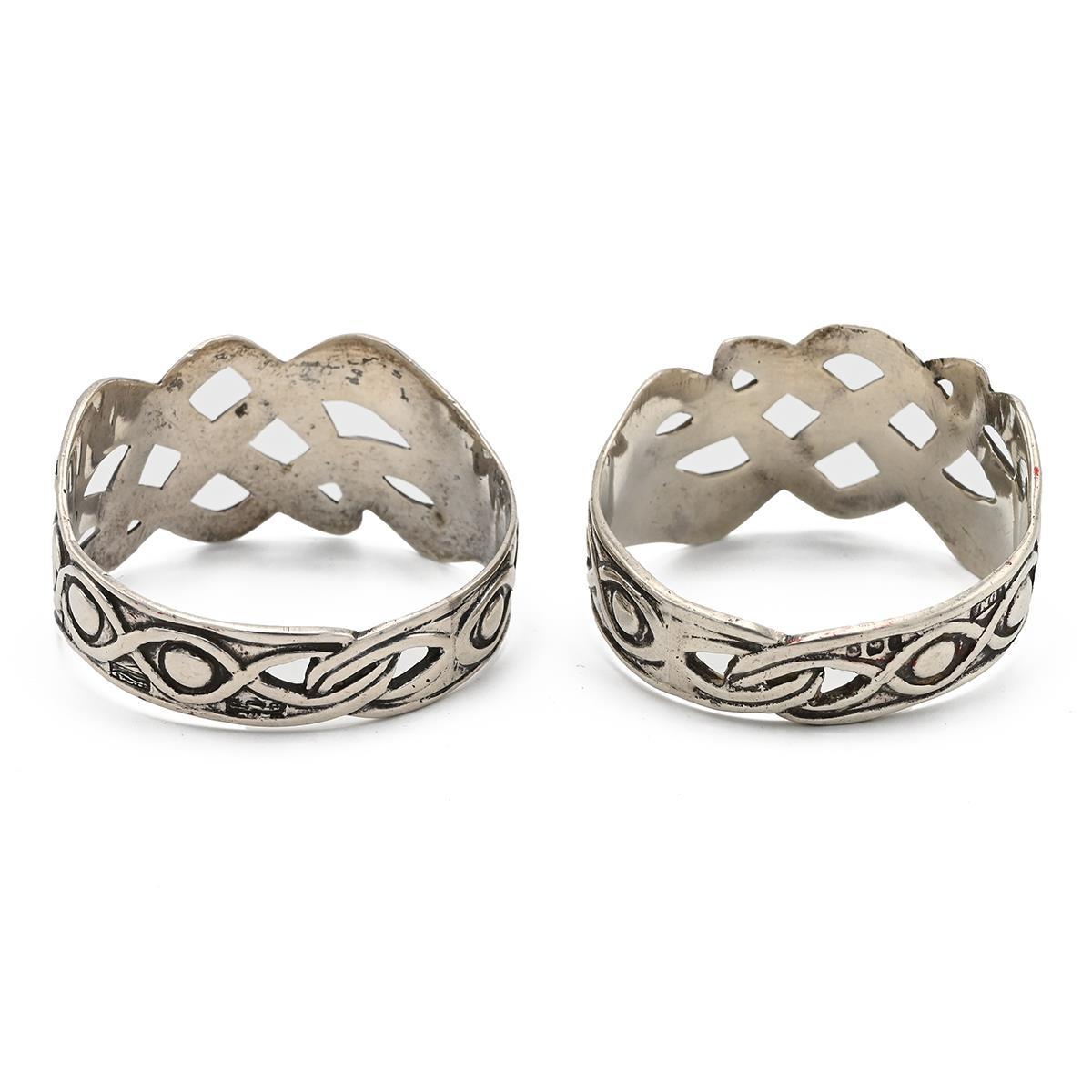 A pair of Iona silver Arts & Crafts napkin rings, in the Celtic style ...