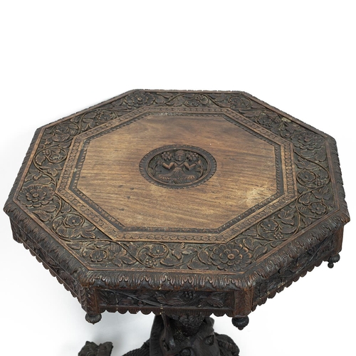 Antique Burmese table, profusely carved throughout. Hexagonal top with ...