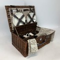 A Mercedes hamper/picnic set, in a fitted wicker basket.