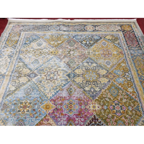 A modern cream ground Carpet with multi coloured centre and multi ...