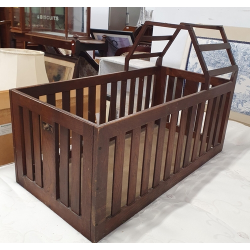A Baby's Cot lacking supports.
