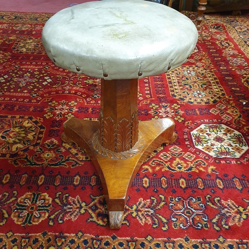 A 19th Century circular piano Stool.