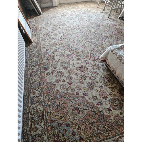 A good and large cream ground Carpet with unique central medallion ...