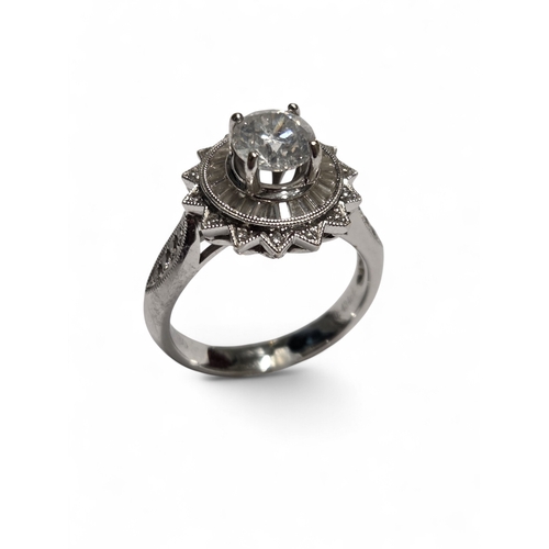 A stunning 18ct White Gold and Diamond cluster Ring, the central ...