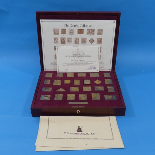 The 'Empire Collection; a cased set of twenty five silver gilt 'Stamp ...