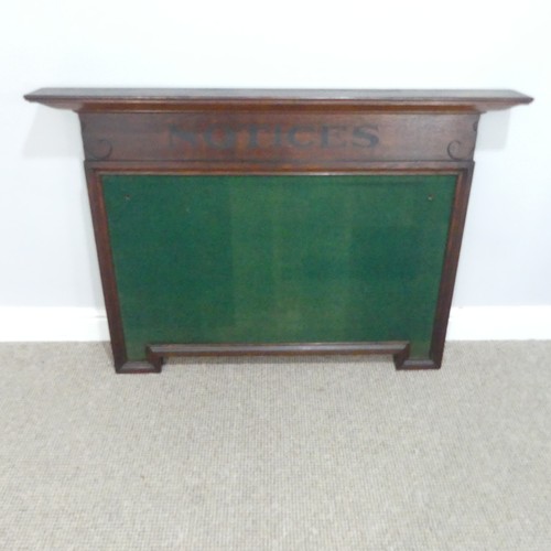 An Arts and Crafts oak Notice Board, with green baize backing, W 108cm ...