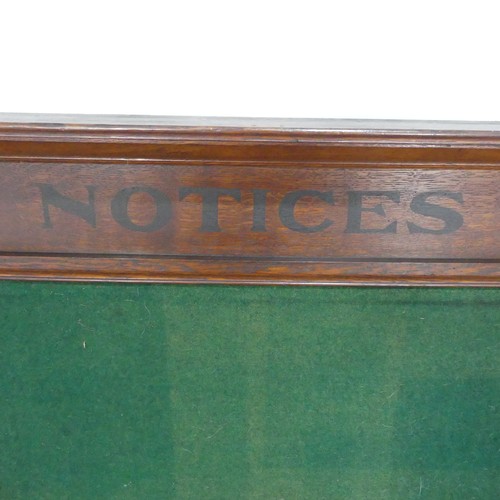 An Arts and Crafts oak Notice Board, with green baize backing, W 108cm ...