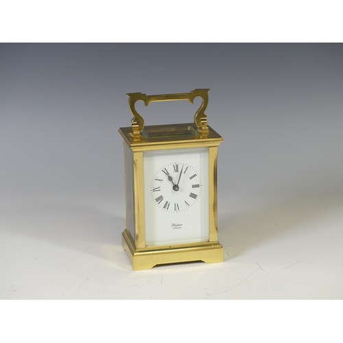 A gilt brass Carriage Clock, of traditional five glass form, dial ...