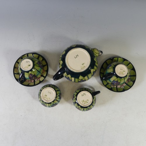 A Moorcroft 'Violet' pattern Tete-a-Tete Tea Set, designed by Sally ...