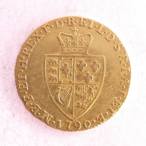 A George III gold Guinea, dated 1790, with spade shaped shield reverse ...