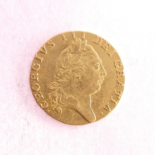 A George III gold Guinea, dated 1790, with spade shaped shield reverse ...
