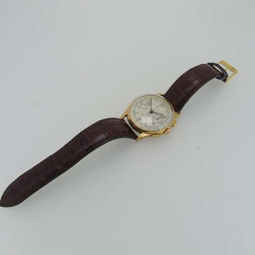 A vintage 18ct gold chronograph Wristwatch, the silvered dial signed ...