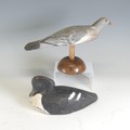 A carved and polychrome painted wooden pigeon Decoy, probably by Harry ...