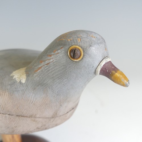 A carved and polychrome painted wooden pigeon Decoy, probably by Harry ...