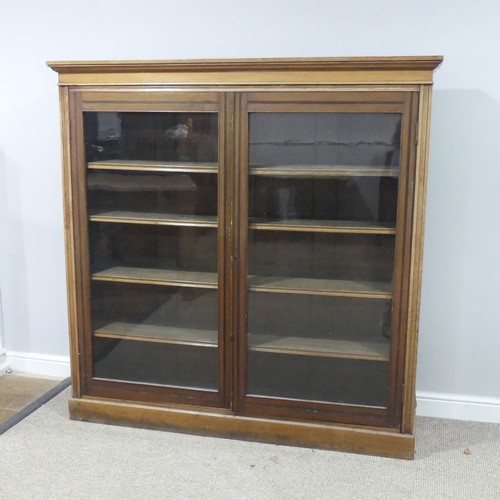 A large Edwardian mahogany glazed Bookcase, with two glazed doors ...