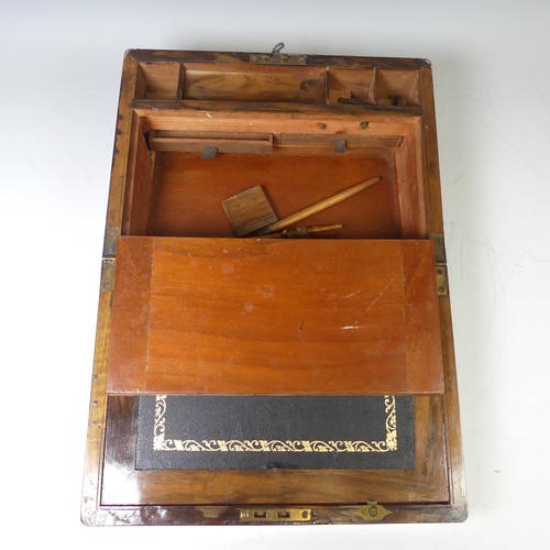 A Victorian brass bound walnut writing Slope, the hinged top enclosing ...