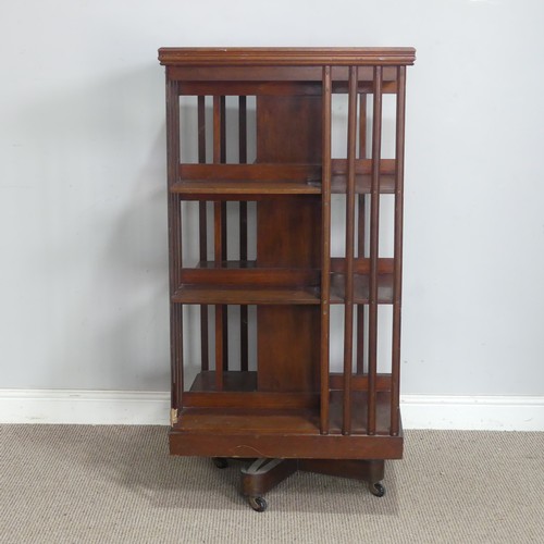 A large Edwardian Trapnell & Gane mahogany revolving Bookcase, with ...