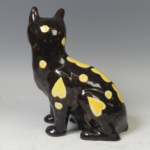 A Mosanic Gallé style faience pottery cat, in black and yellow with ...