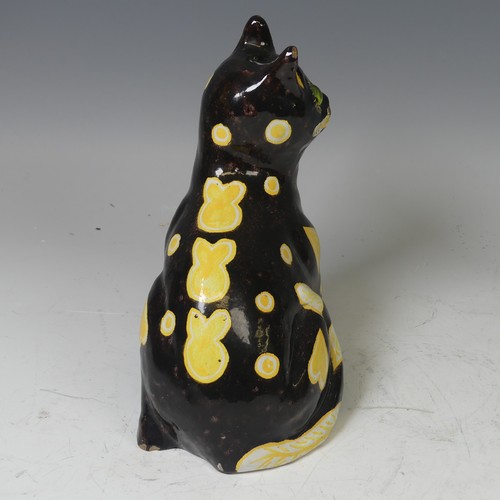 A Mosanic Gallé style faience pottery cat, in black and yellow with ...