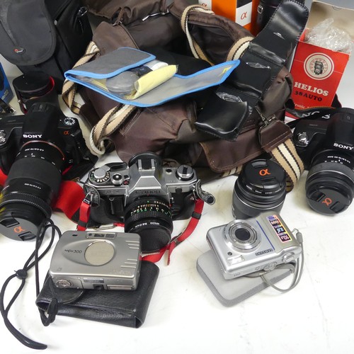 An interesting collection of Cameras and related equipment, including ...