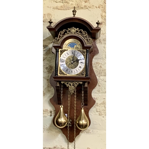 A SUN AND MOON DUTCH WALL CLOCK WITH HORSE RIDER PENDULUM AND WEIGHTS