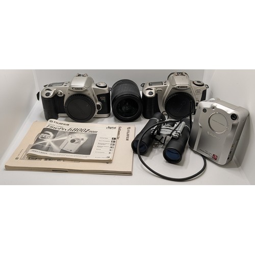 Two Canon Eos SLR Camera bodies - the Eos300 and an Eos500N and a ...