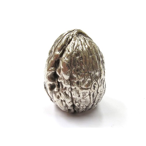 A silver model of a walnut stamped Tekform 925 to base